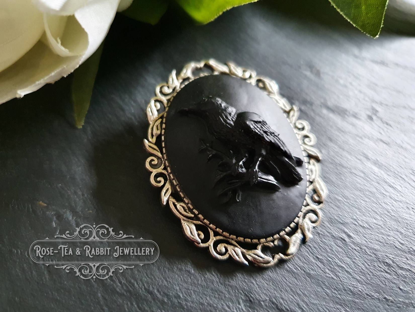 Poe silver brooch store